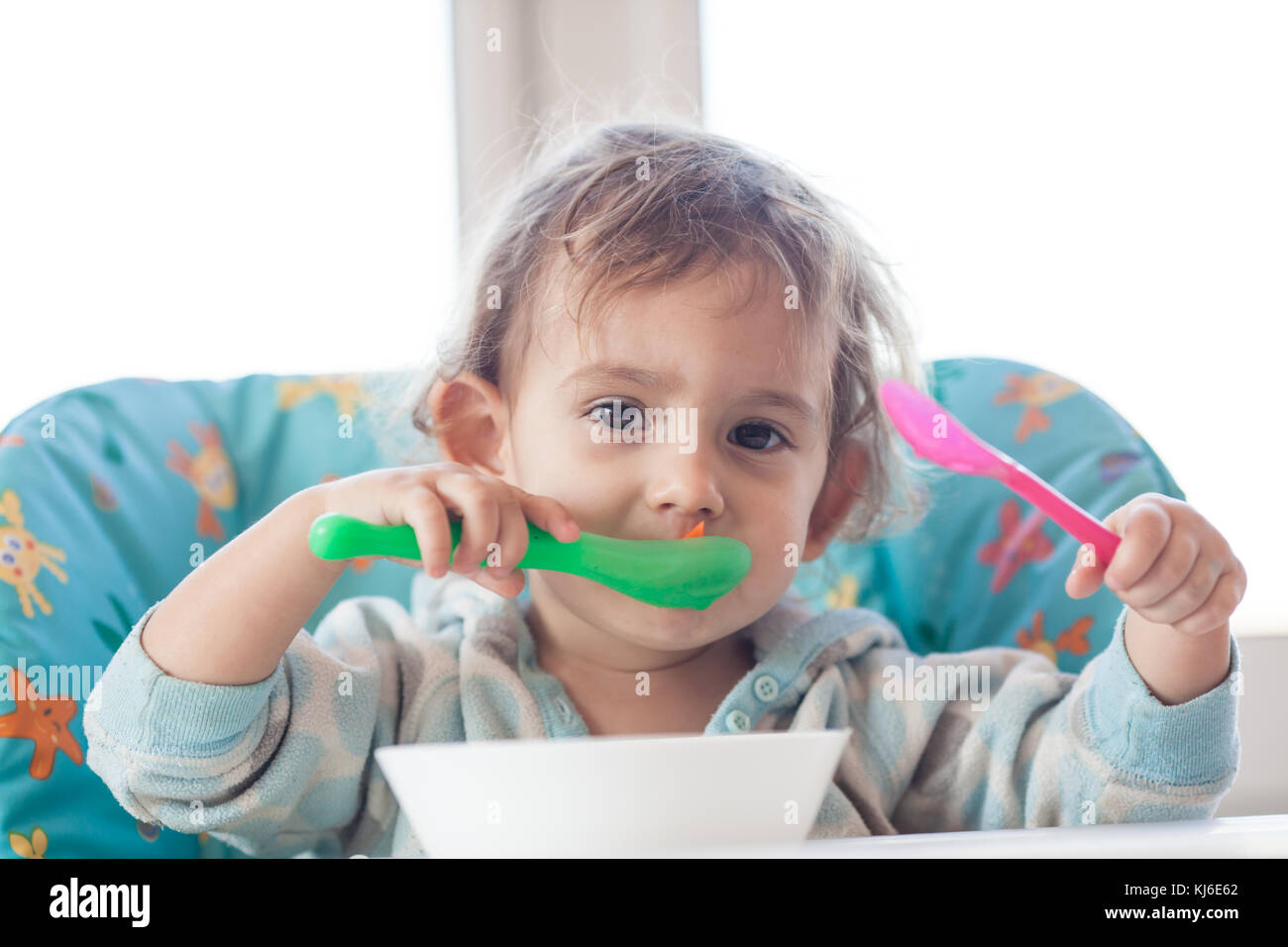 The girl is eating very fast Stock Photo - Alamy