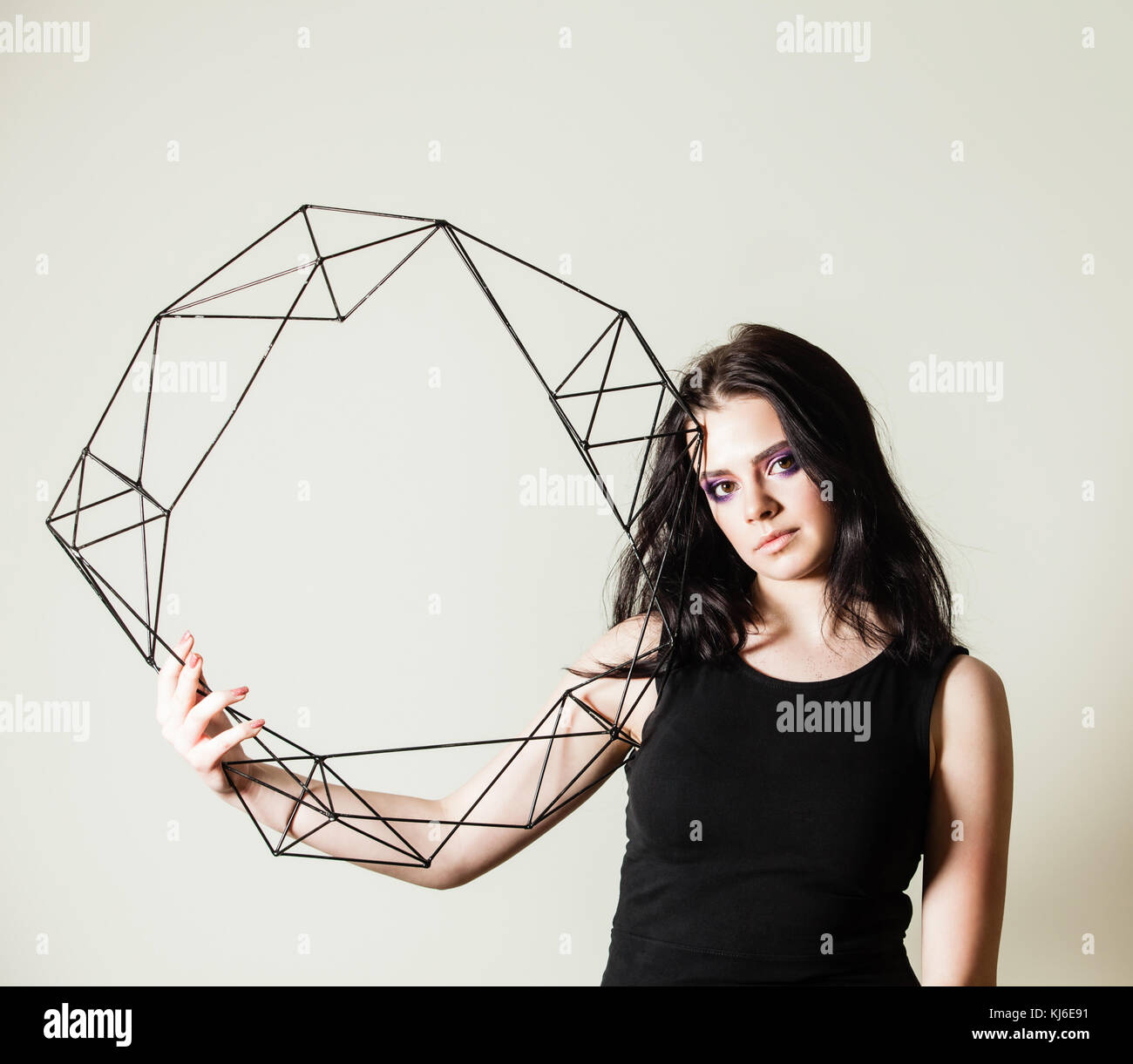 Female holding model of geometric solid Stock Photo - Alamy