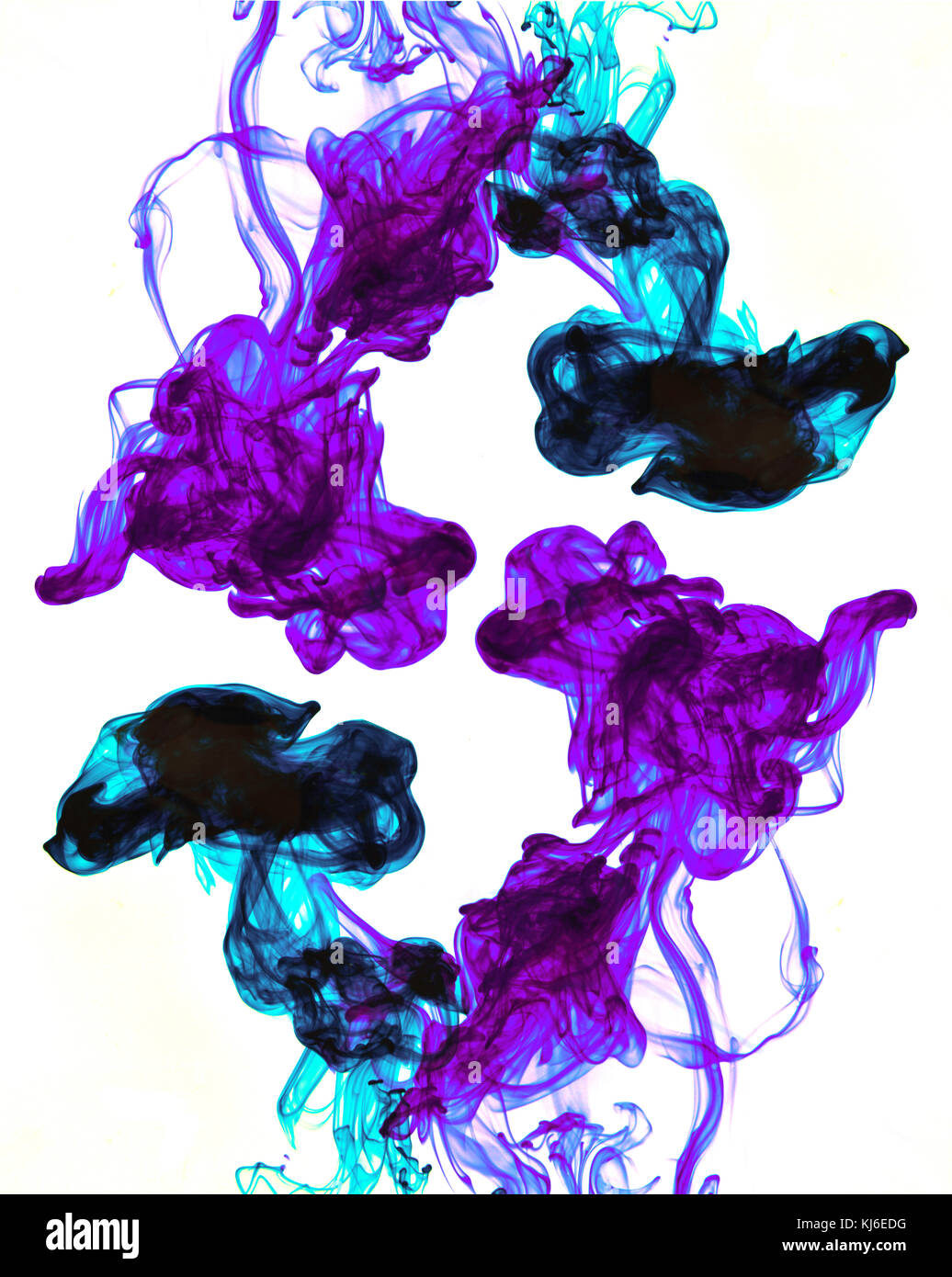 Color drop in water photographed in motion. Cloud of colorful ink in ...