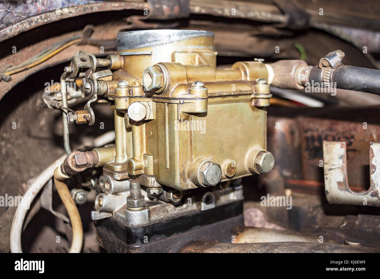 Vintage carb on the old engine Stock Photo - Alamy