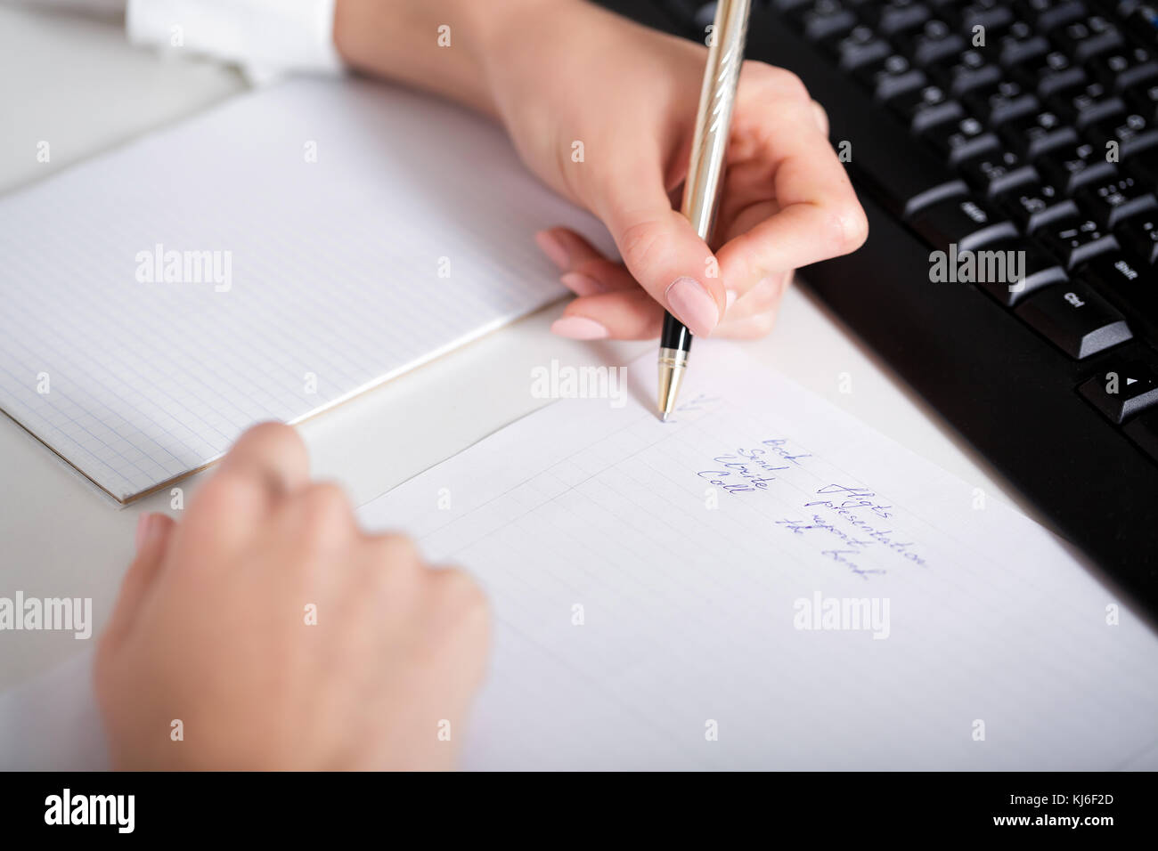 business woman hand writing on paper Stock Photo - Alamy