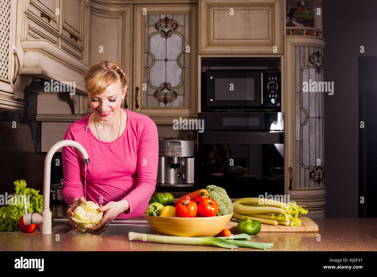 Woman in the kitchen Stock Photo - Alamy