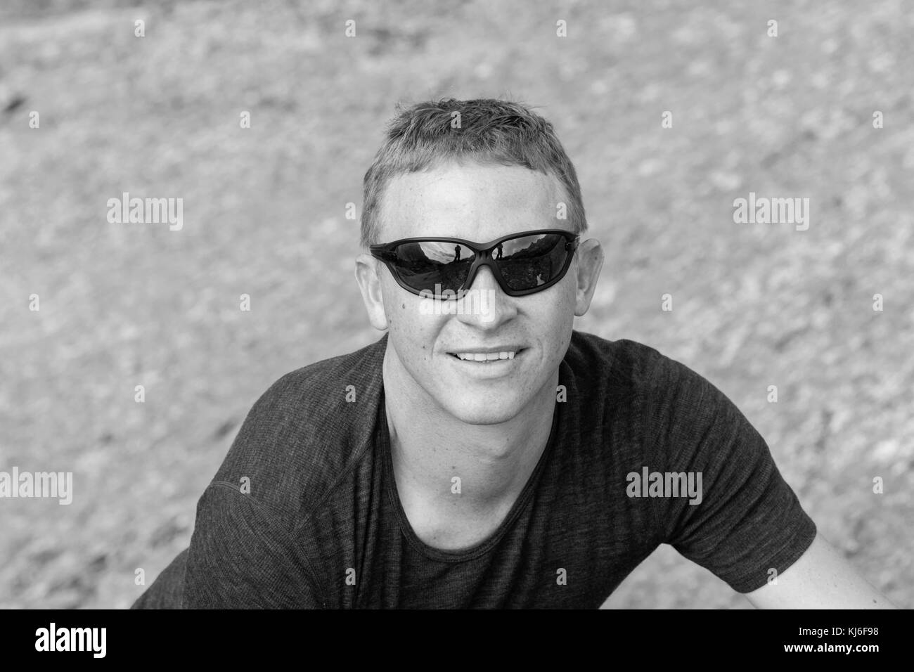 A climber makes climbing exercises on a big rock Stock Photo - Alamy
