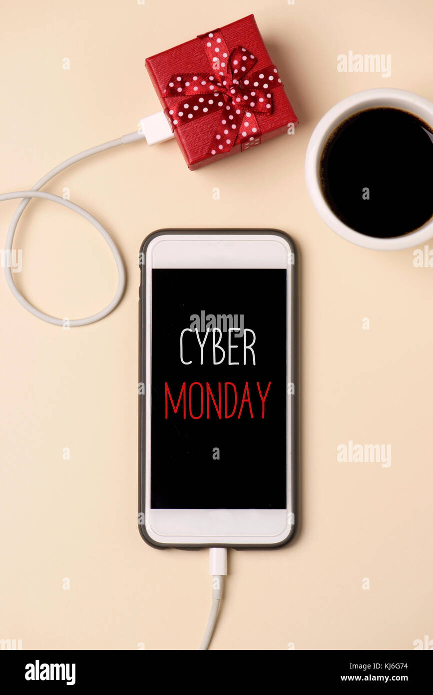 high-angle shot of a smartphone with the text happy cyber monday in its ...