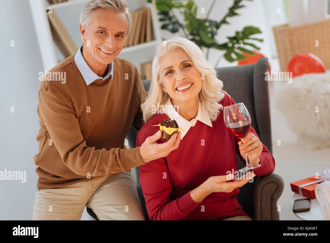 Radiant husband and wife getting excited over their anniversary Stock ...