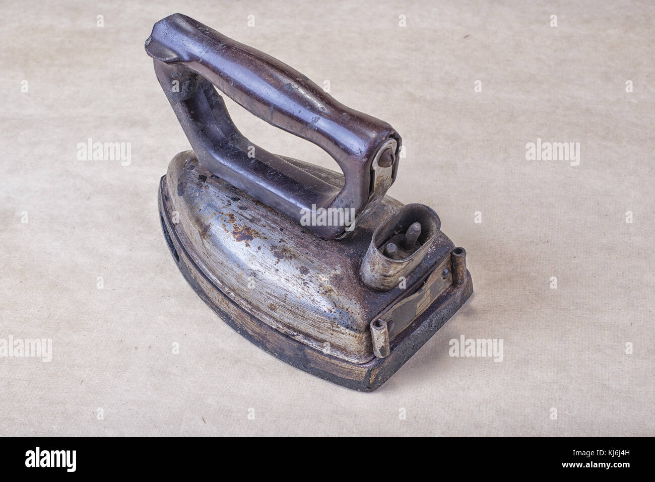Old classic electric iron burned out from sixties Stock Photo - Alamy