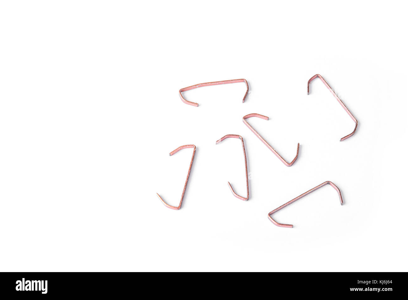 Used industrial staples on the white background Stock Photo - Alamy