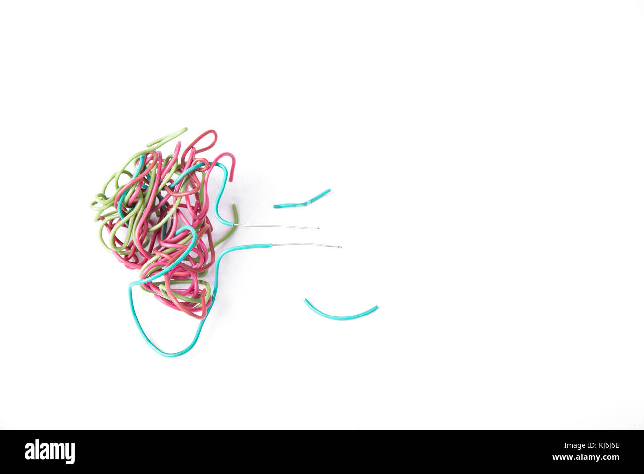 Tangled isolated wire on the white background Stock Photo - Alamy