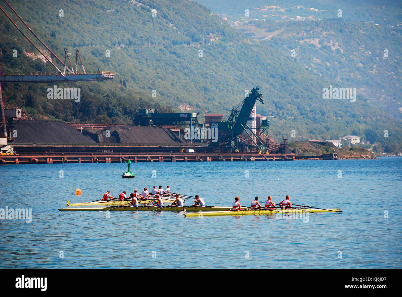 Young men rowing boat hi-res stock photography and images - Alamy