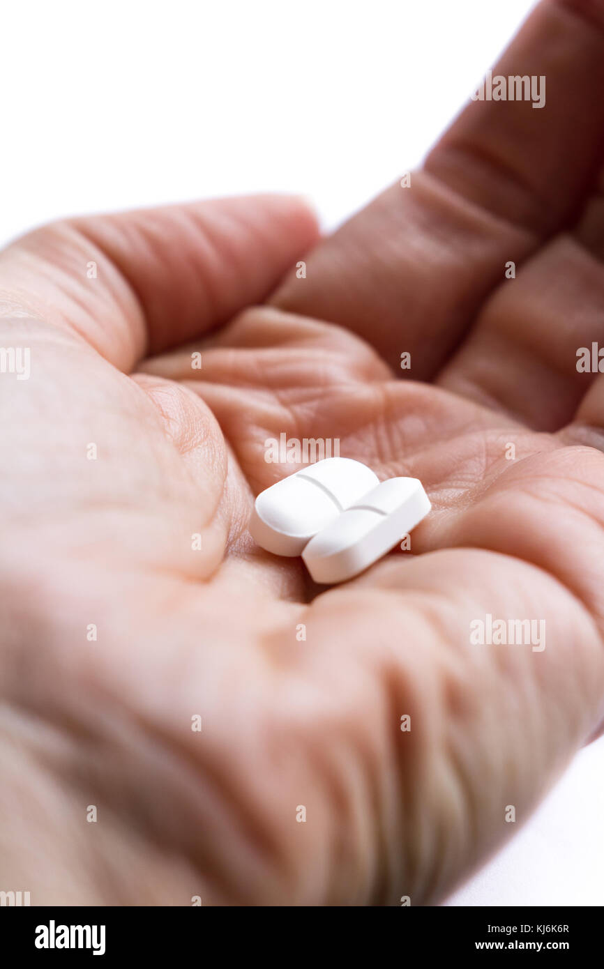 close up of two opioid tablets on a hand Stock Photo - Alamy