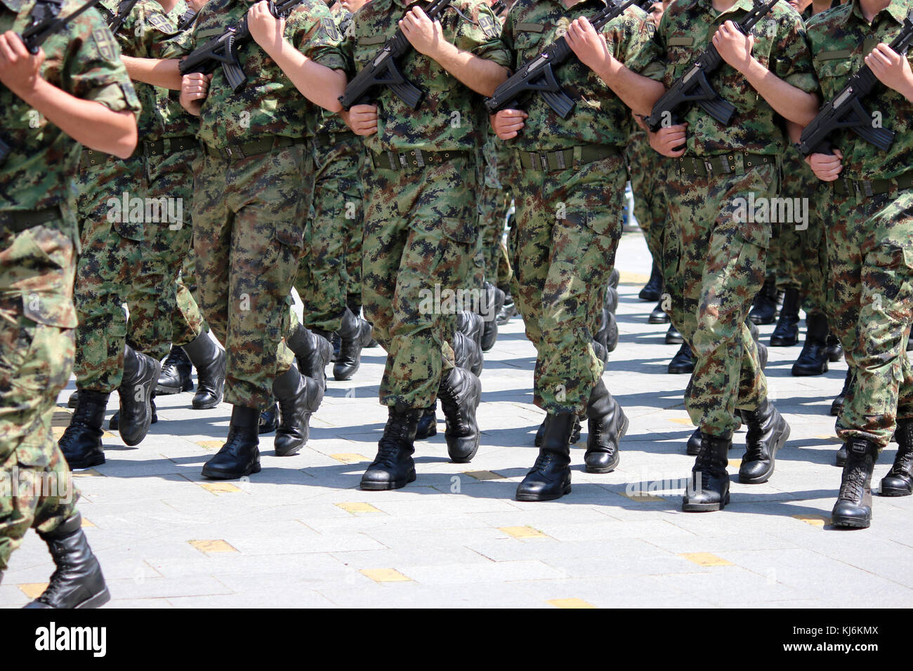 Soldiers with camouflage uniforms marching with rifles Stock Photo - Alamy