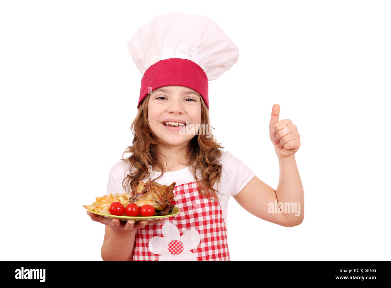 happy little girl cook with chicken wings and thumb up Stock Photo - Alamy