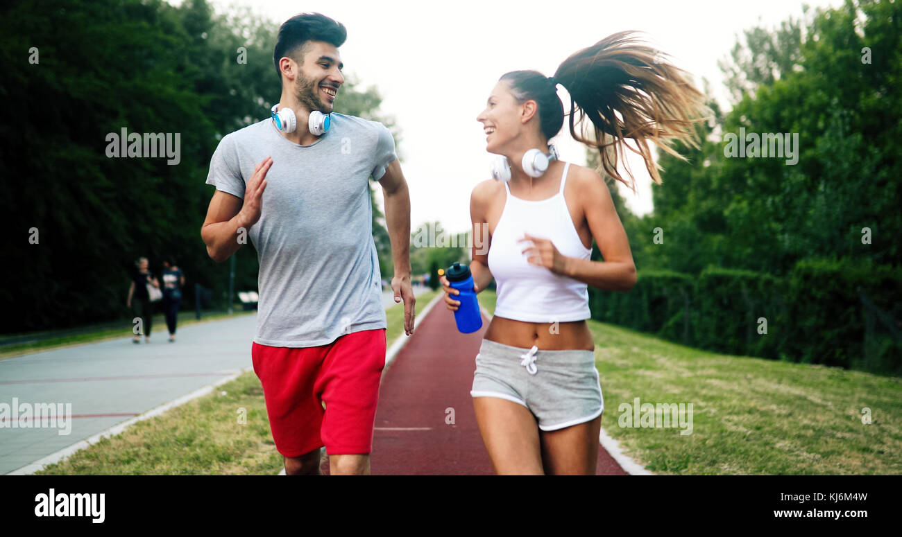 Couple jogging outdoors Stock Photo - Alamy