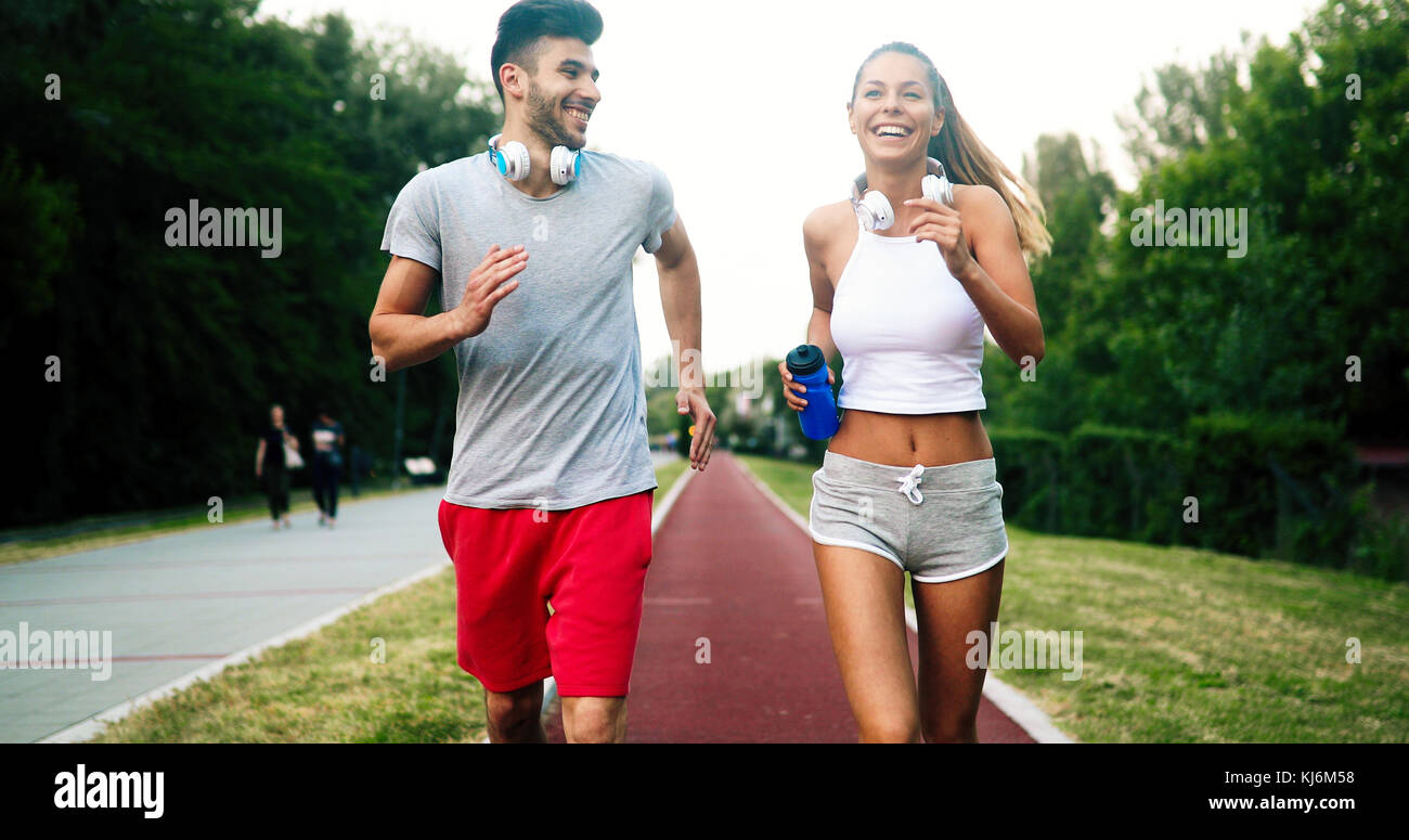 Athletic couple jogging together Stock Photo - Alamy
