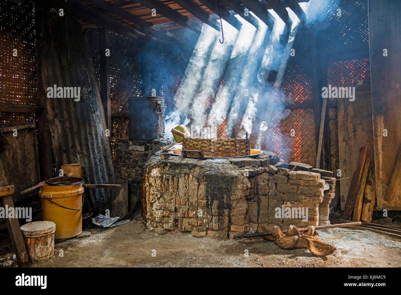 Primitive palm sugar factory boiling the collected sap near Pangandaran ...