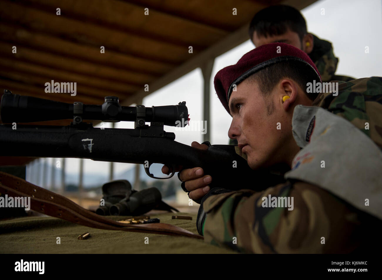 An Afghan Commando prepares to fire his rifle during advanced ...
