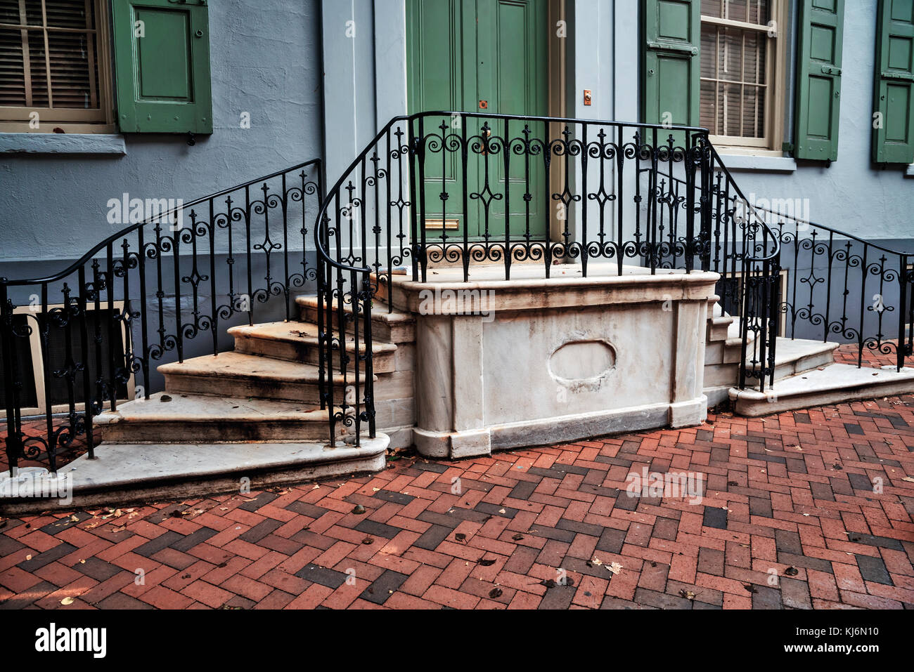 Marble porch of an old house with openwork metal railing, Philadelphia ...