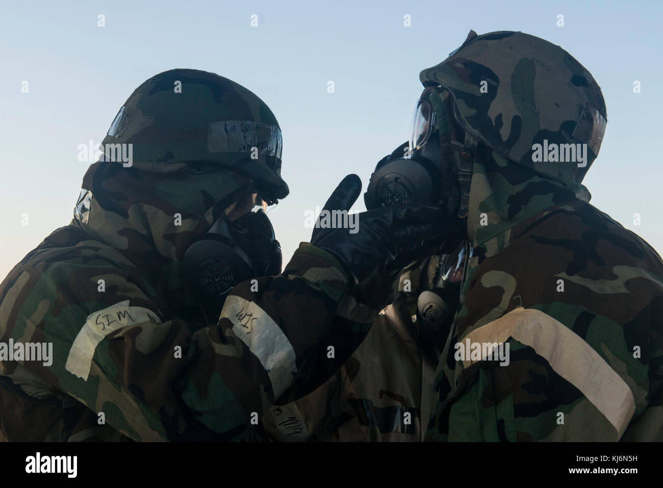 U.S. Airmen perform a buddy check during the first Rapid Ready Weasel ...
