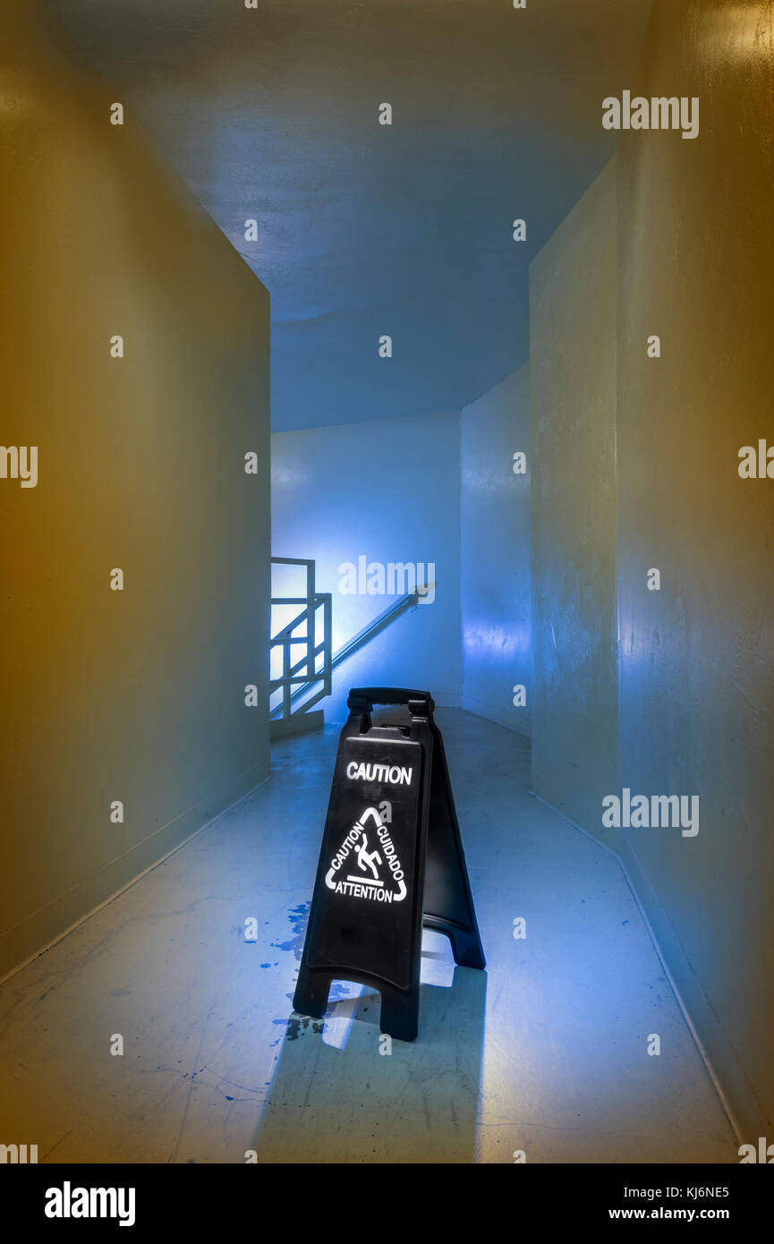 Caution Sign In Industrial Hallway Stock Photo - Alamy