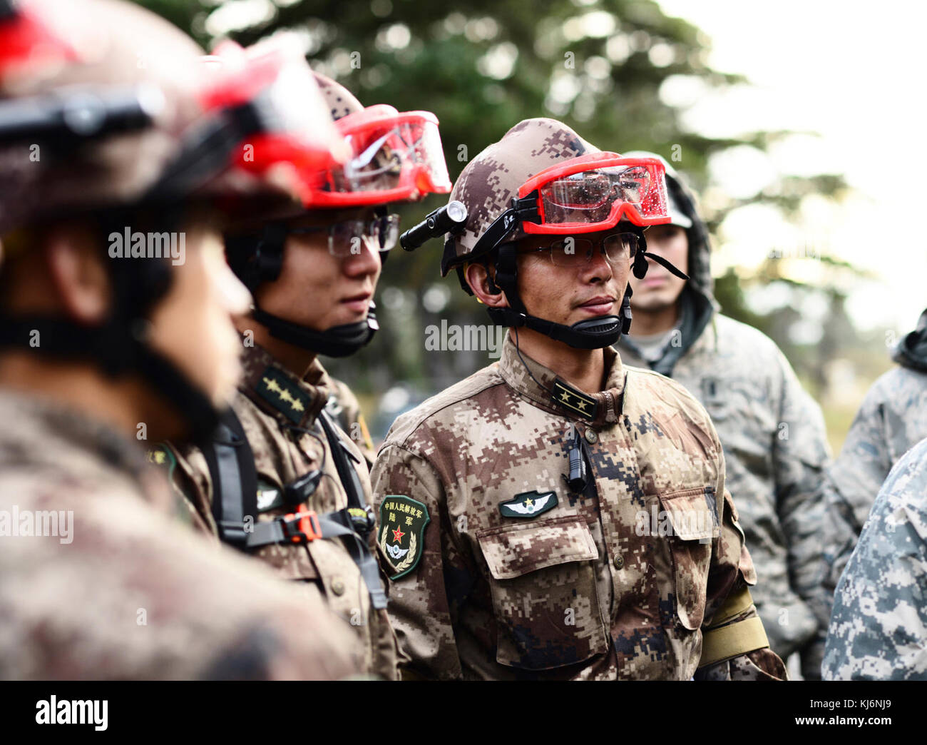 Soldiers from the People’s Liberation Army (PLA) listen to a briefing ...