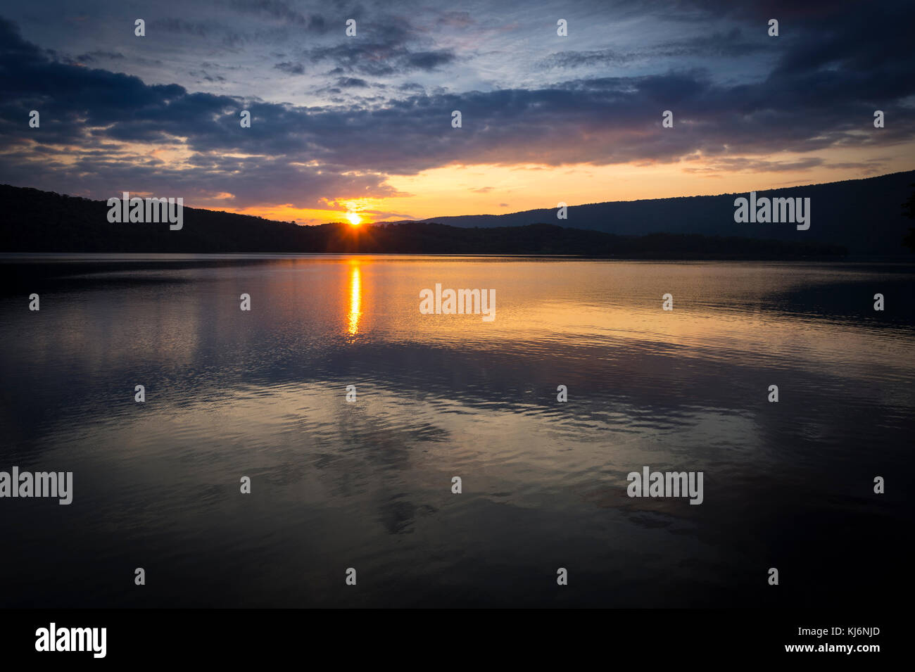Mountain lake with reflection at sunrise hi-res stock photography and ...