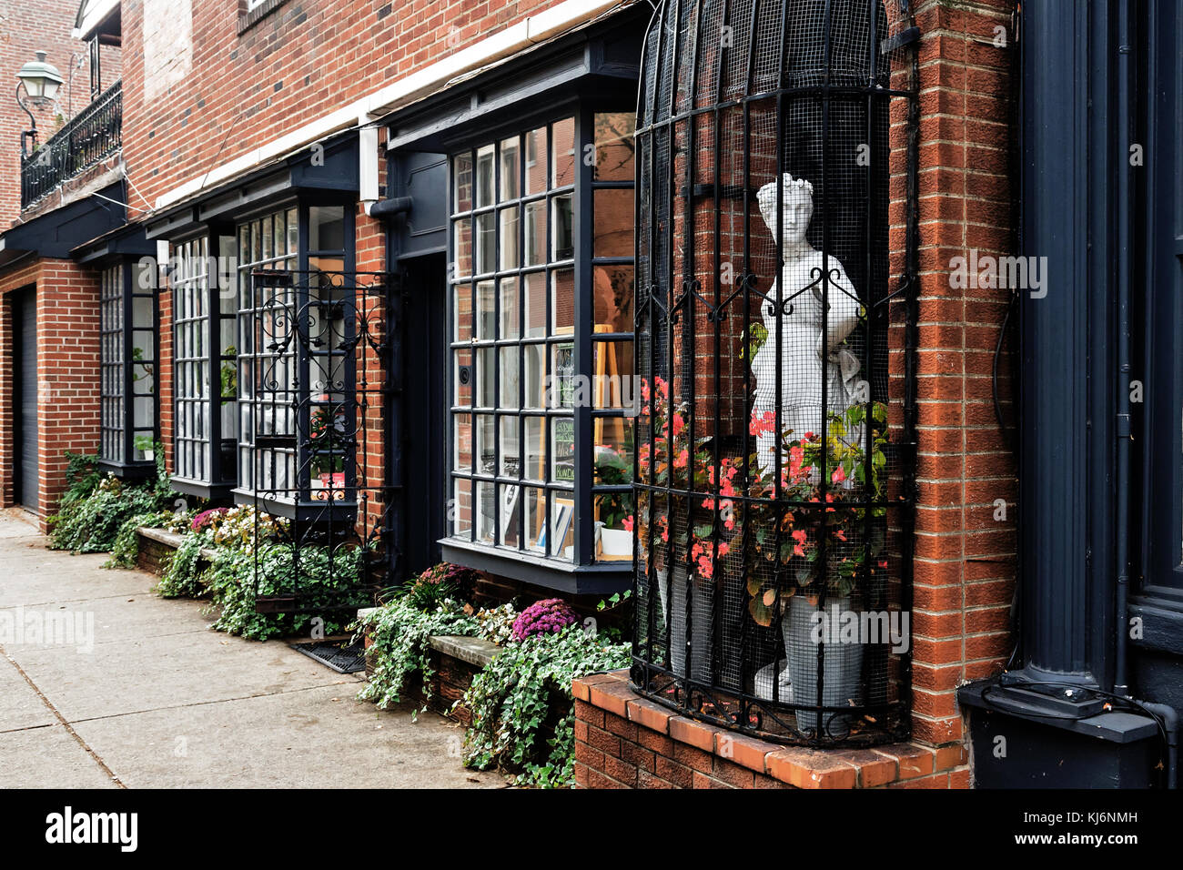 White antique sculpture in window of ancient building, Philadelphia ...