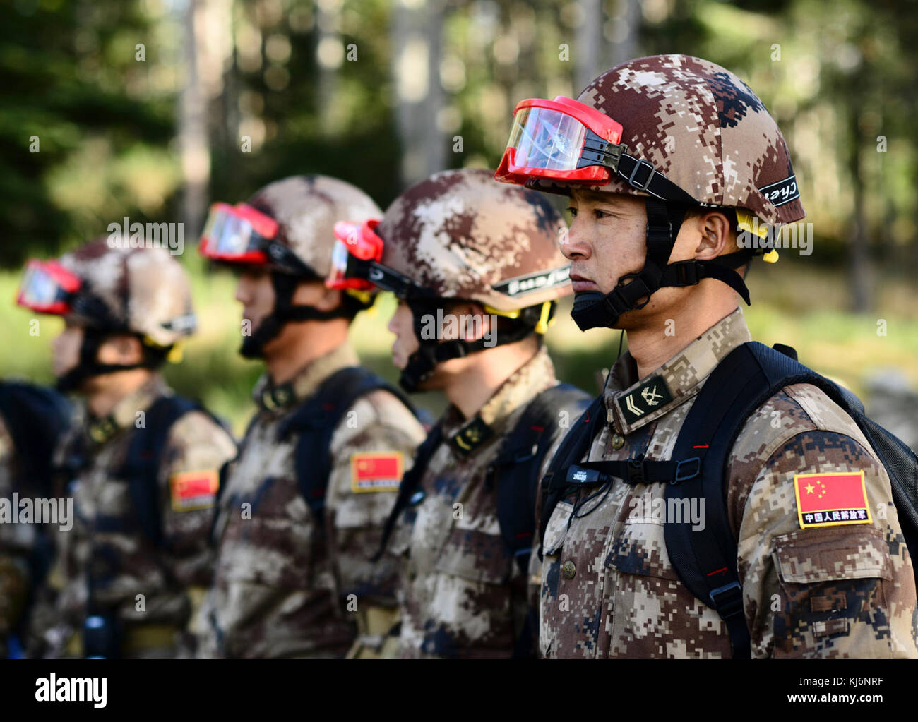 Soldiers from the People’s Liberation Army (PLA) listen to a briefing ...