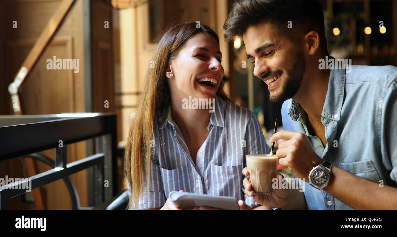Young attractive couple on date in coffee shop Stock Photo - Alamy