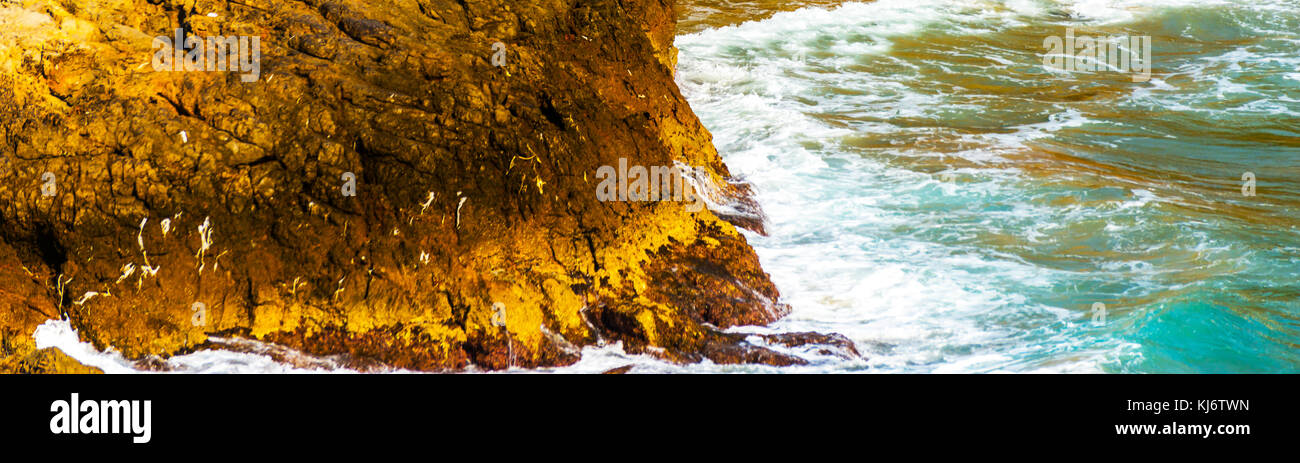 high cliff above the sea, summer sea background, many splashing waves ...