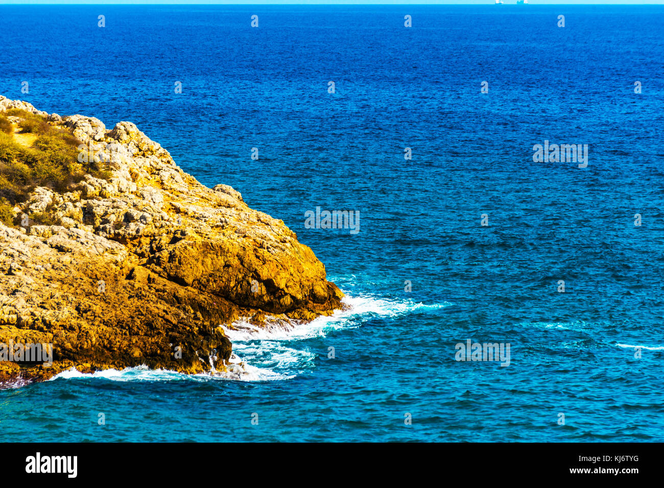 high cliff above the sea, summer sea background, many splashing waves ...