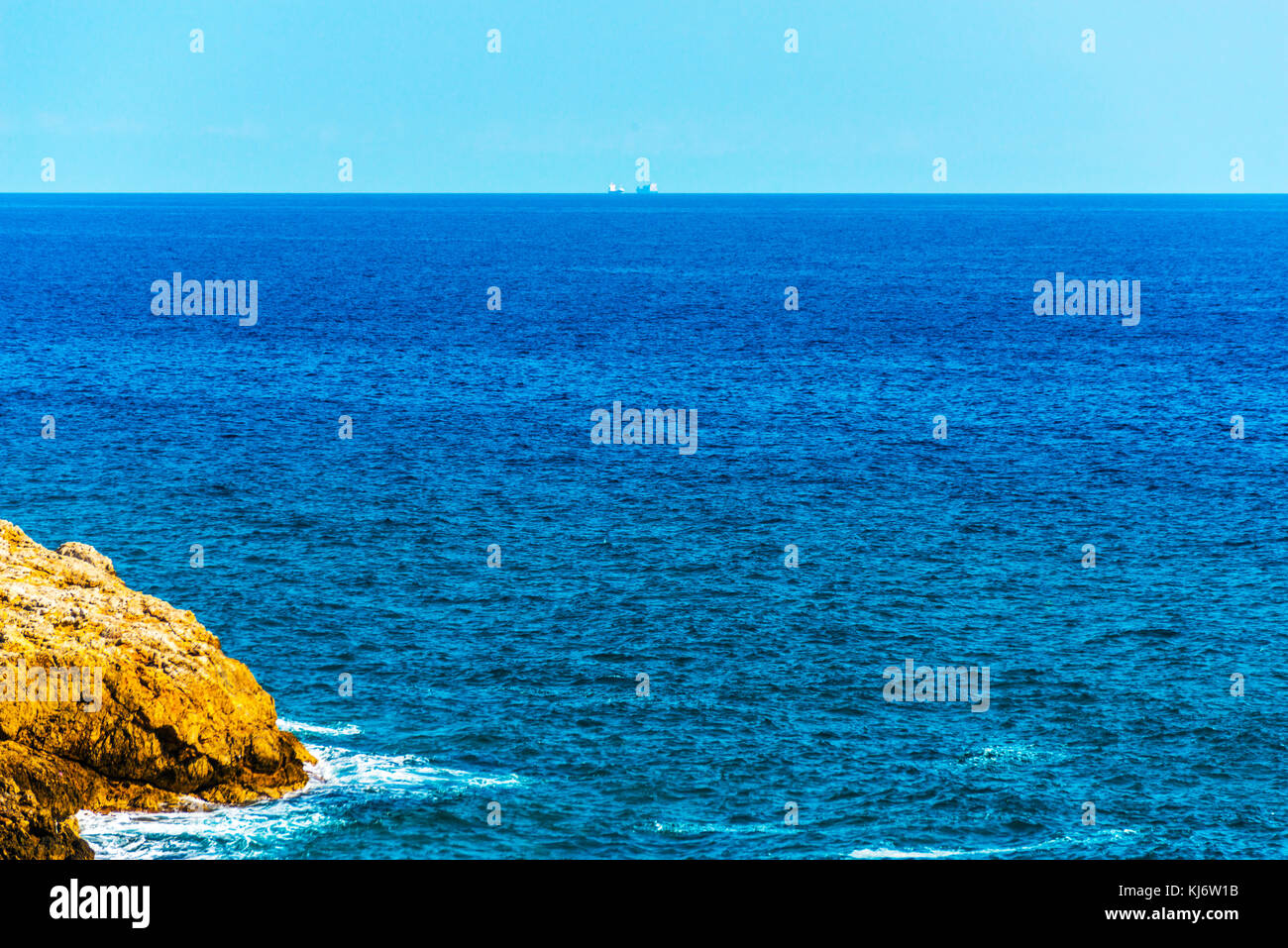 high cliff above the sea, summer sea background, many splashing waves ...
