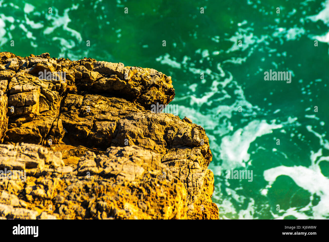 high cliff above the sea, summer sea background, many splashing waves ...