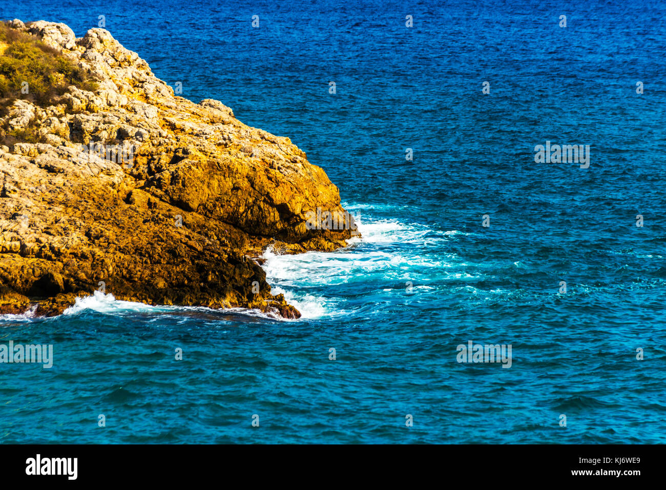 high cliff above the sea, summer sea background, many splashing waves ...