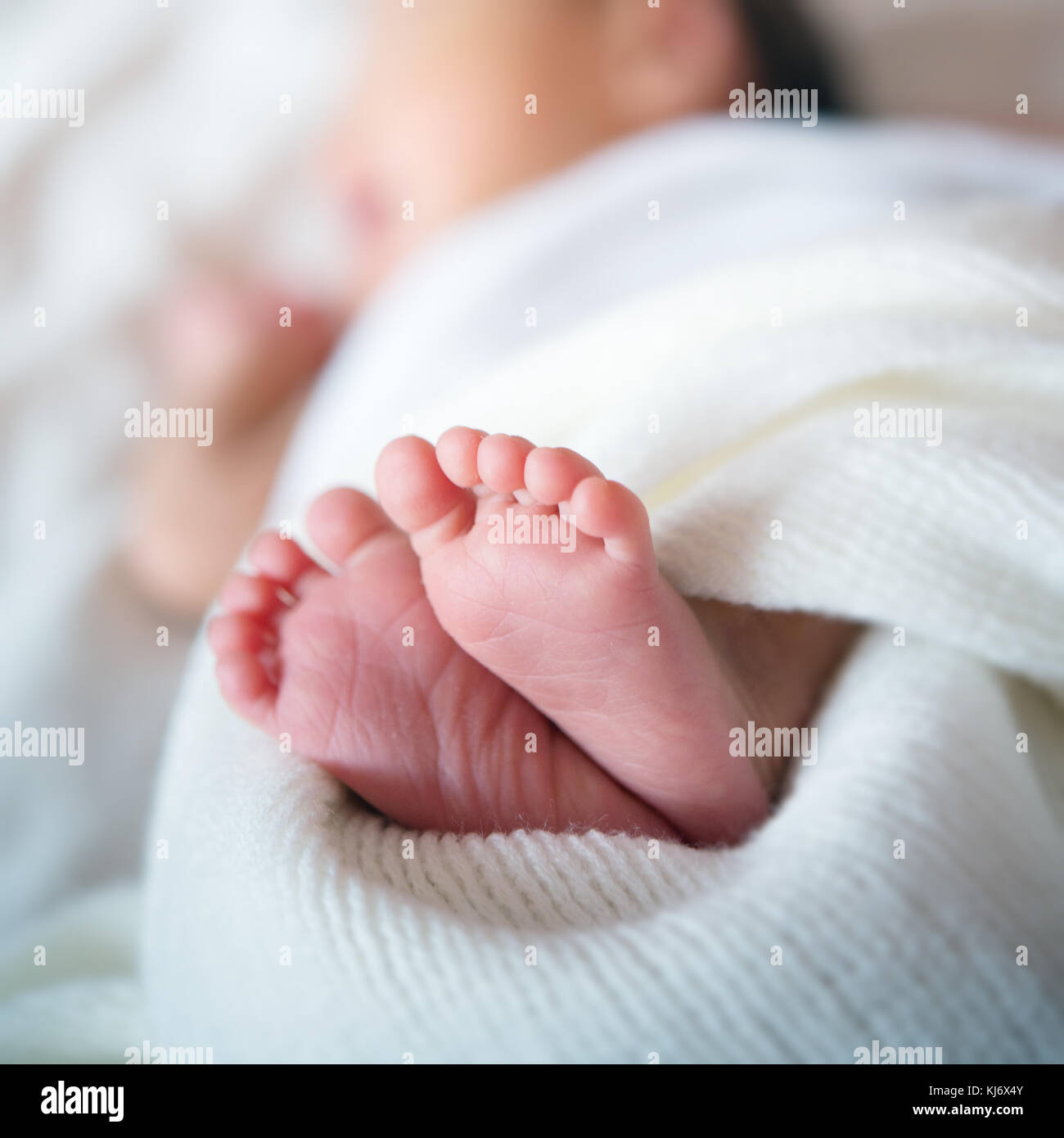 New born infant baby feet Stock Photo - Alamy