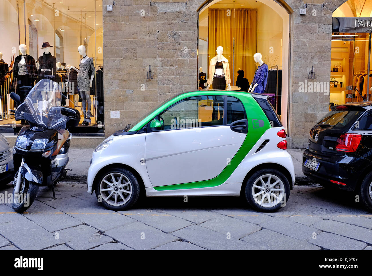 smart electric car parked outside fashion store, florence, italy Stock ...