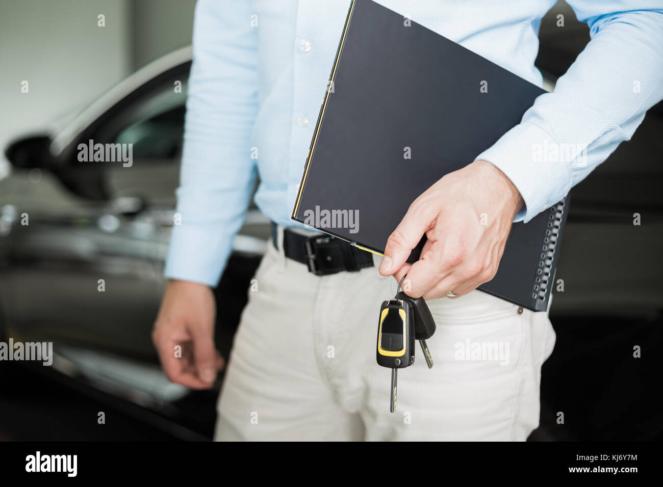 Man standing behind car hi-res stock photography and images - Alamy