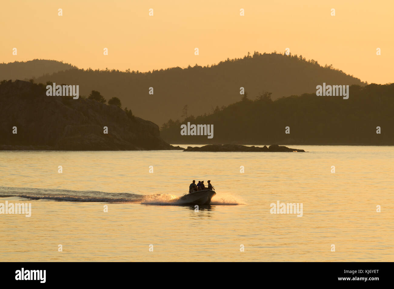 Silhouette of powerboat on Lake Superior at sunset Stock Photo - Alamy