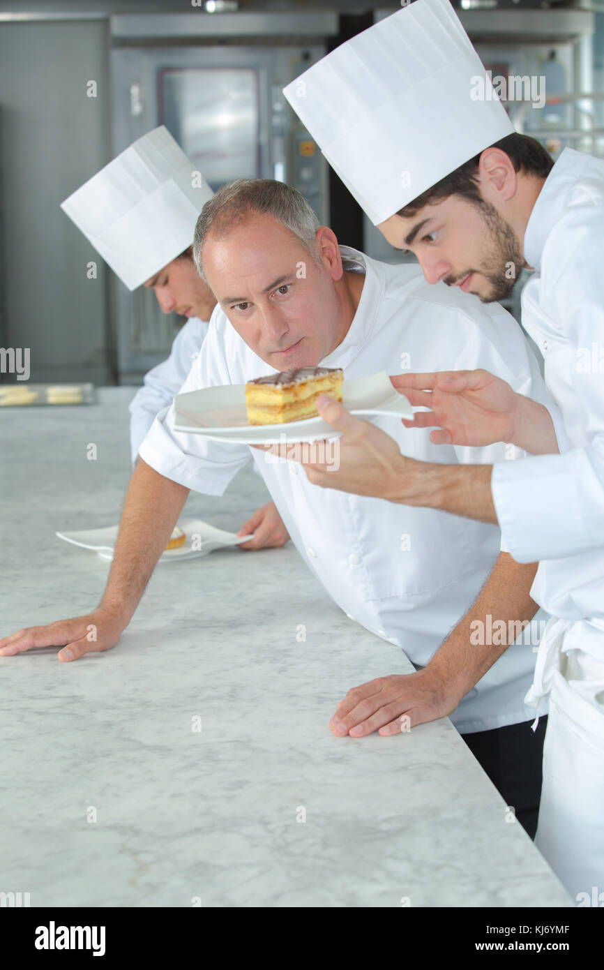 students and teacher in a professional cook school kitchen Stock Photo ...