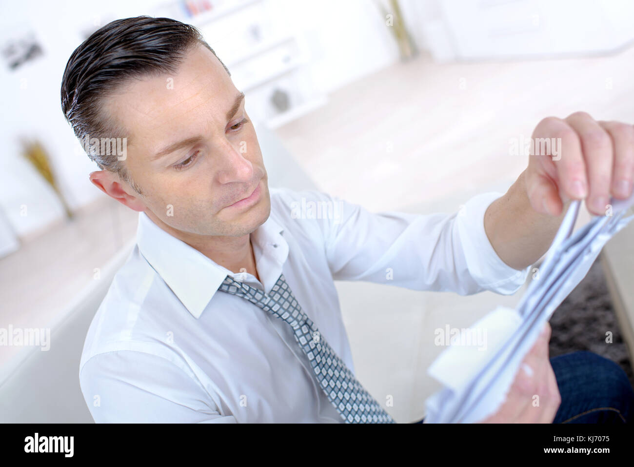 Businessman sitting outside checking hi-res stock photography and ...
