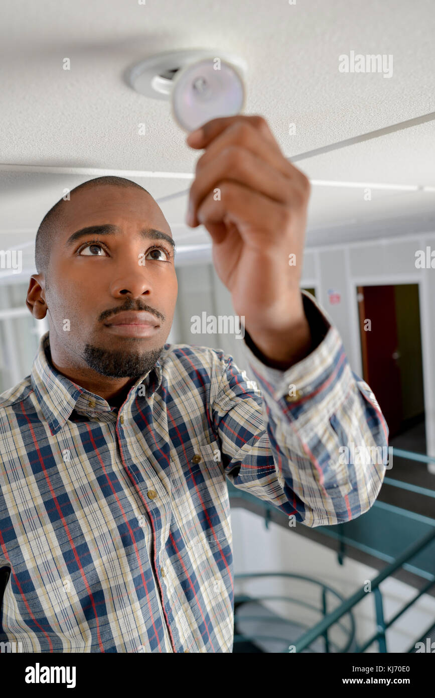 Young man checking a spotlight Stock Photo - Alamy