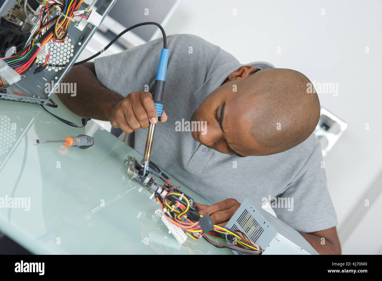 Man soldering hi-res stock photography and images - Alamy