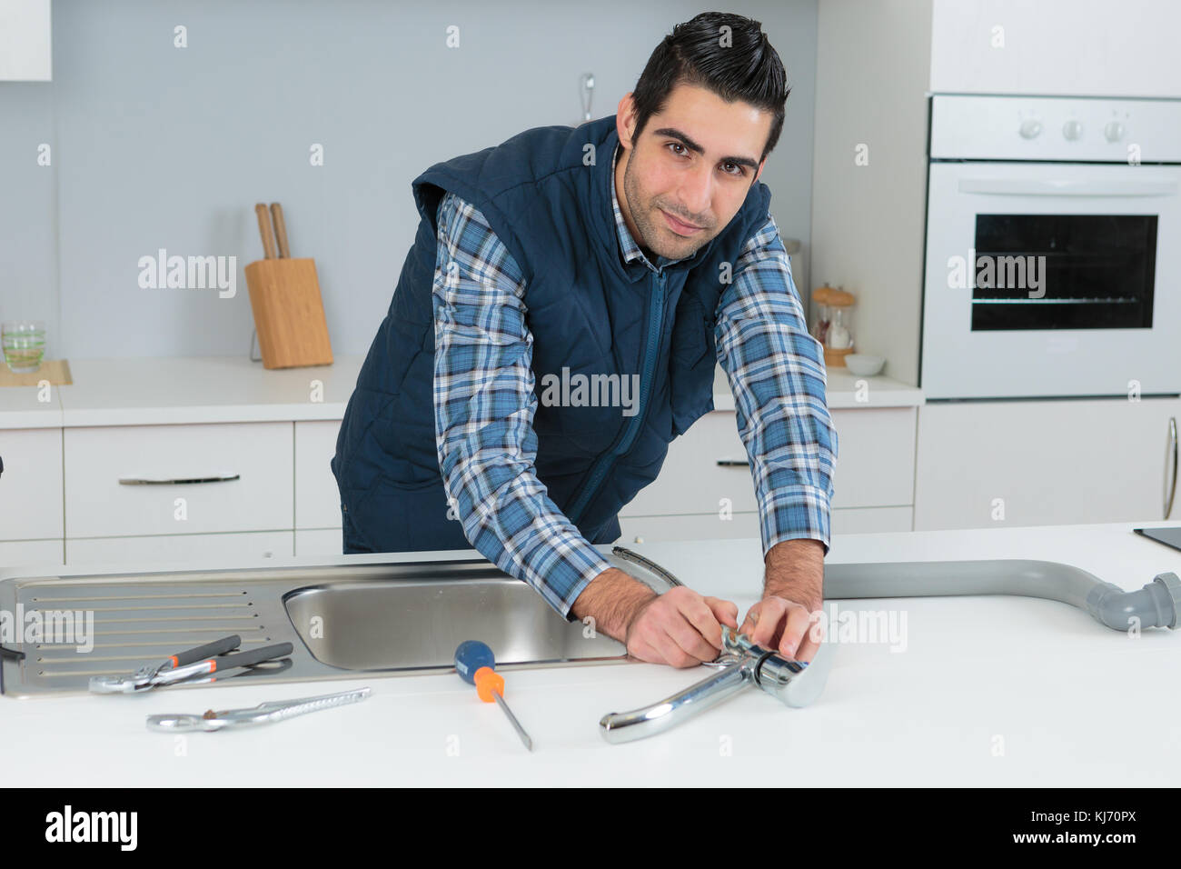 installing a tap Stock Photo - Alamy