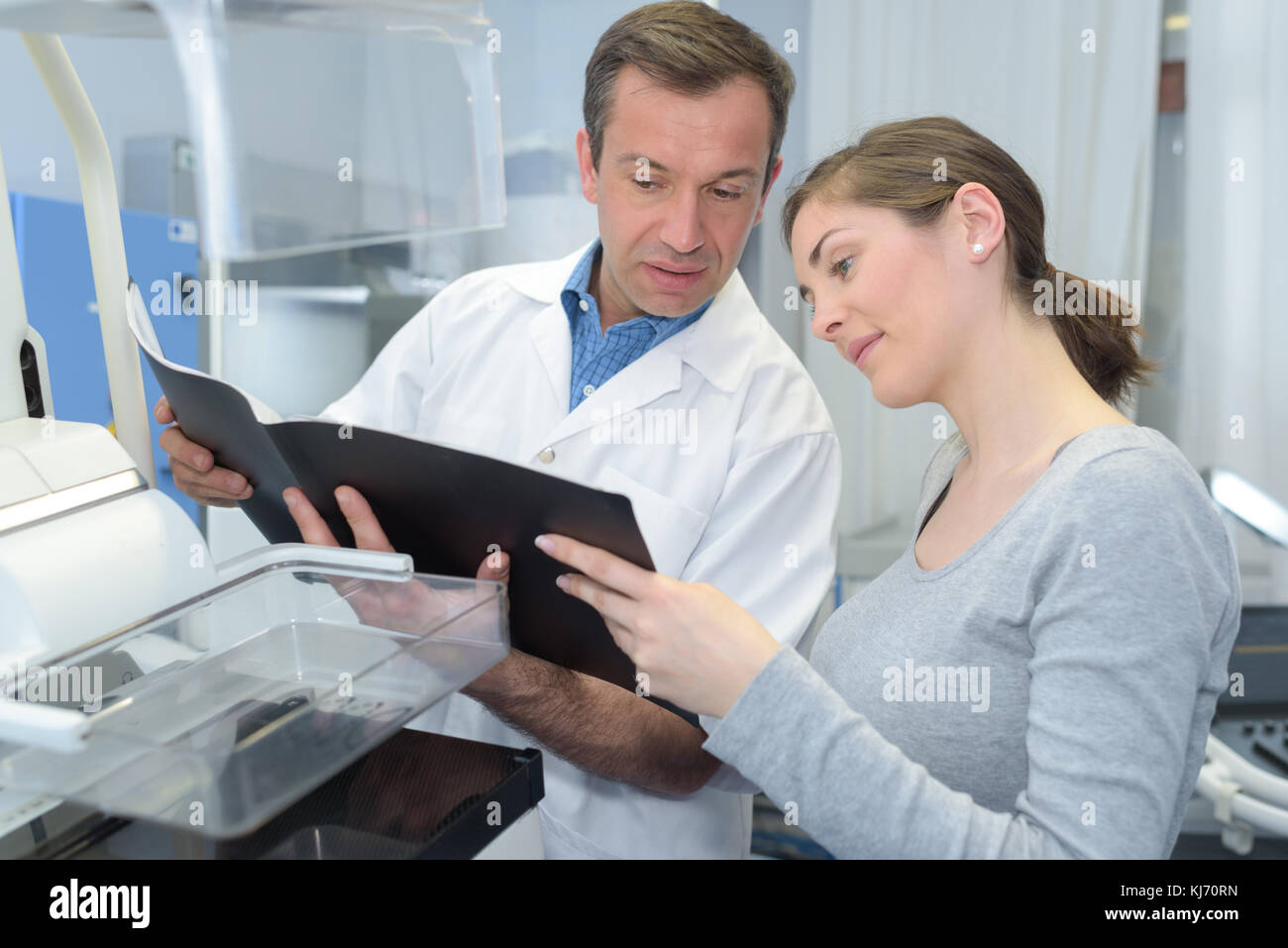 Nurse woman checking documents hi-res stock photography and images - Alamy