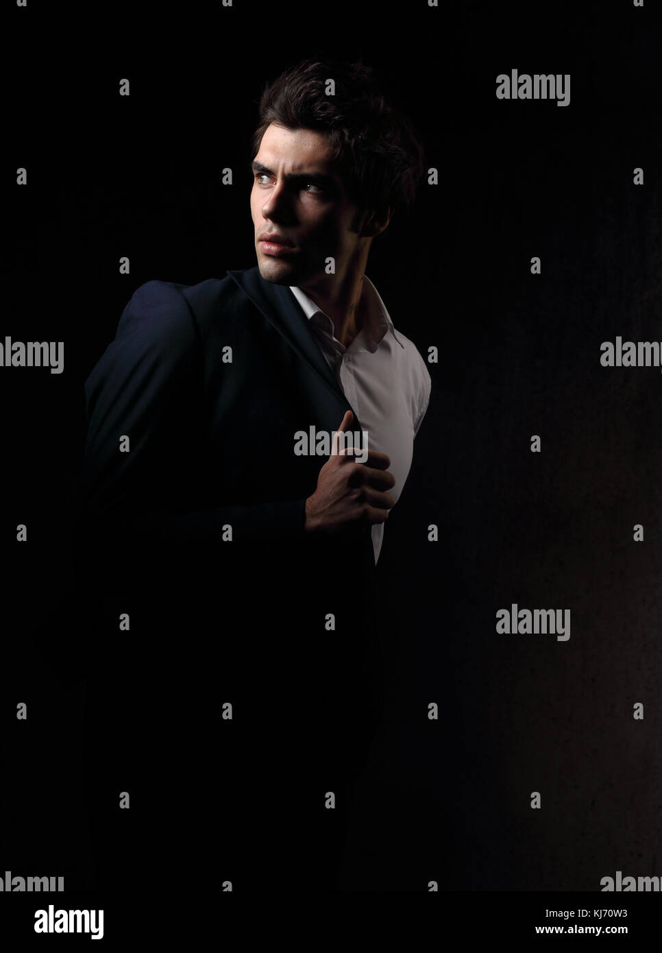 Thinking depression charismatic man looking up on dark shadow dramatic ...