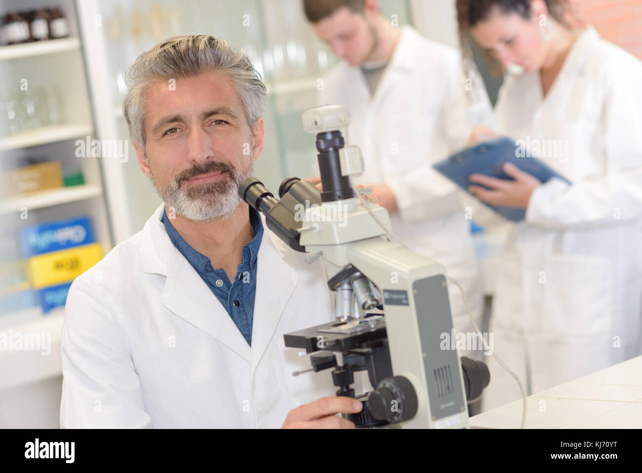 male scientific researcher using microscope in the laboratory Stock ...