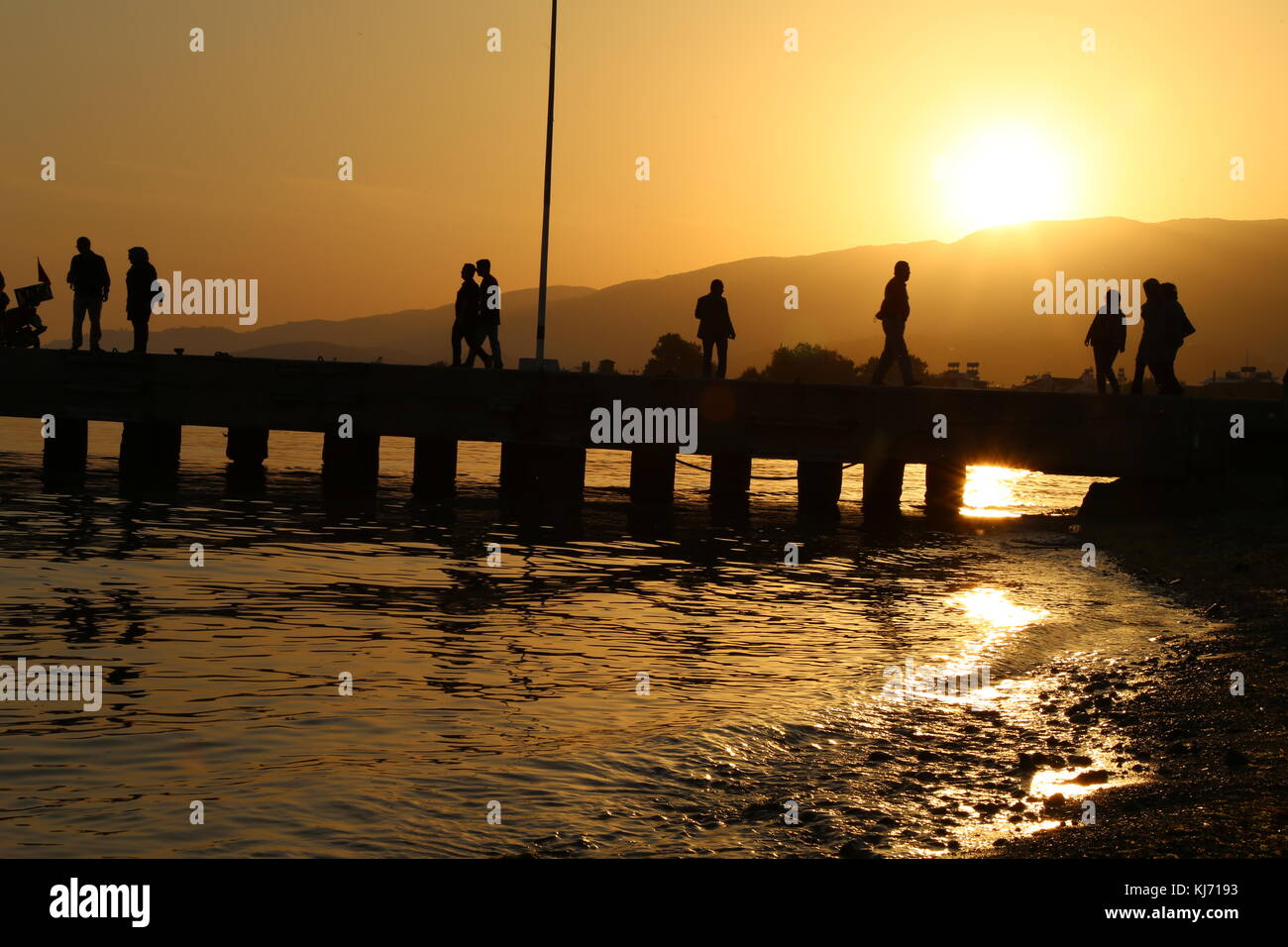 Silhouette of any people on landing stage Stock Photo - Alamy