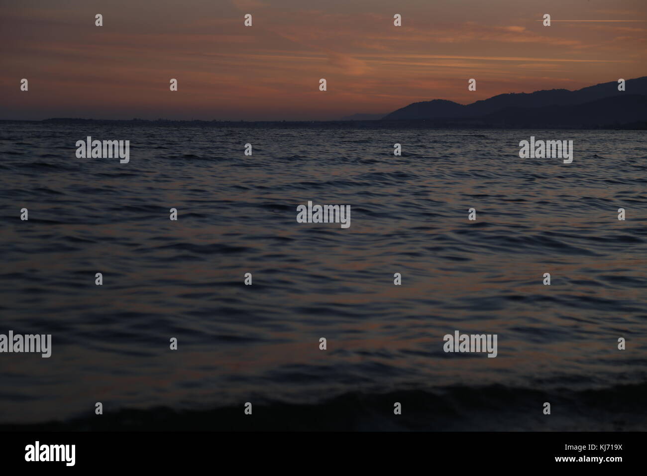 Silhouette of rocks by sunset in turke Akcay Edremit Stock Photo - Alamy