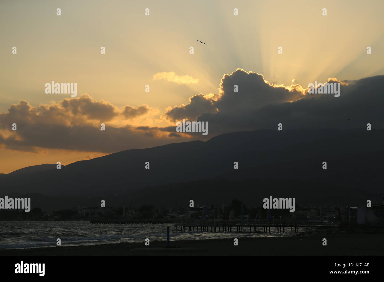 Silhouette of rocks by sunset in turke Akcay Edremit Stock Photo - Alamy