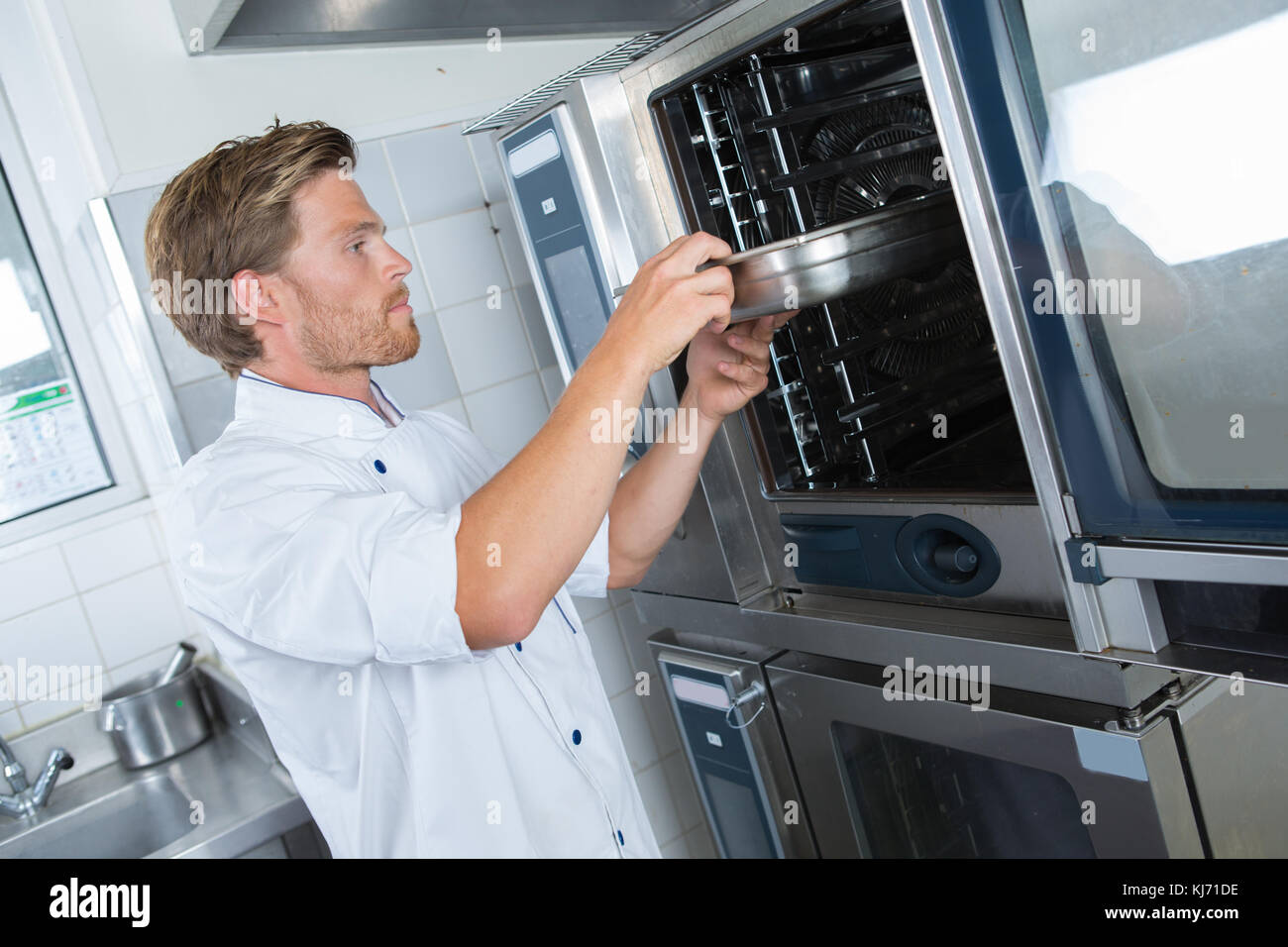 Young baker using commercial hi-res stock photography and images - Alamy