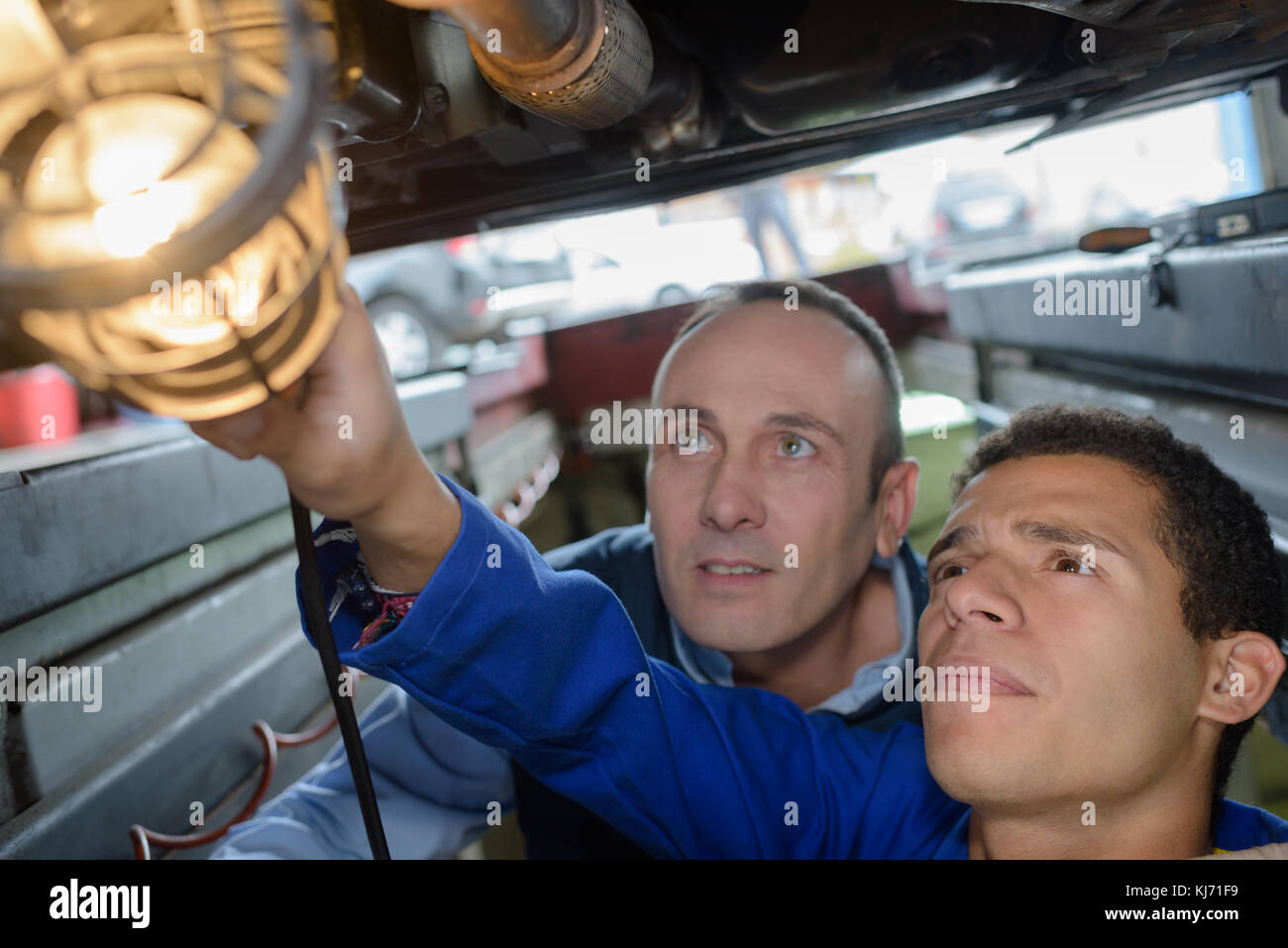 factory worker fixing a light bulp Stock Photo - Alamy